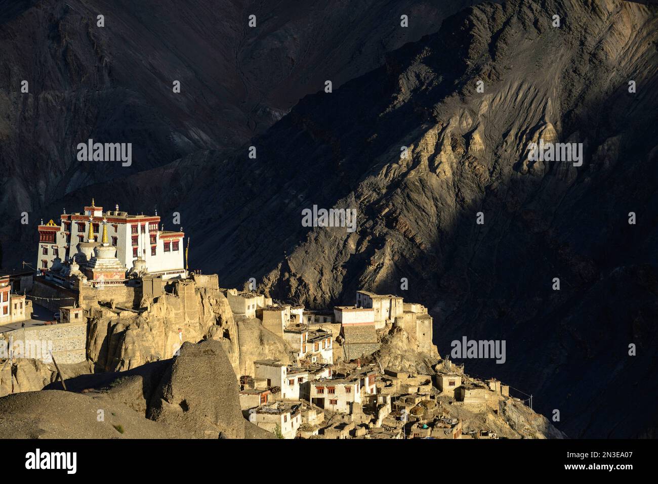 View of the Tibetan Buddhist Lamayuru Monastery on a clifftop at sunset ...