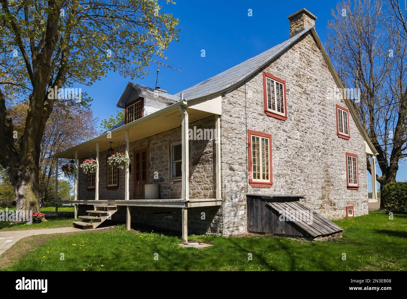 Old 1835 fieldstone house exterior in spring hi-res stock photography ...