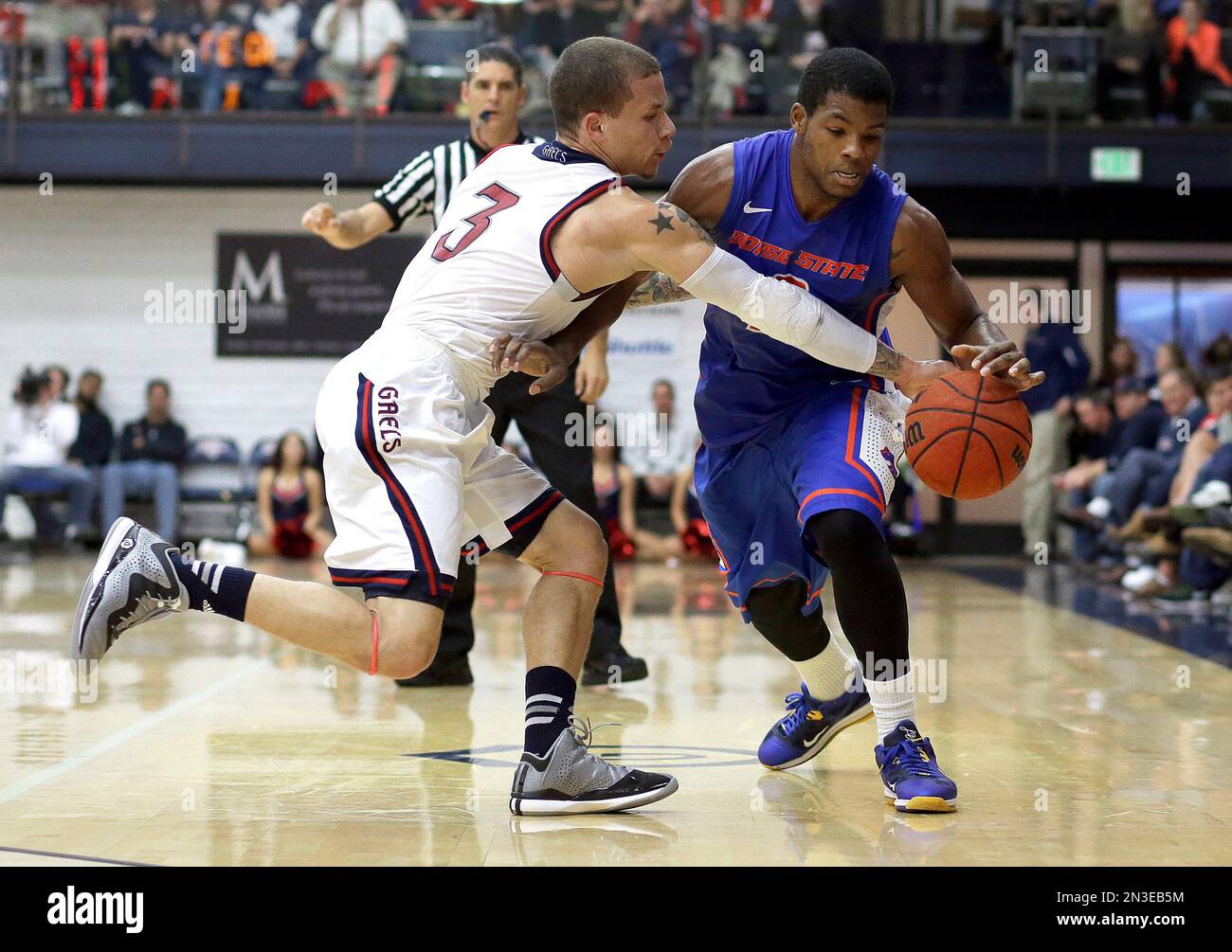 Saint Mary's Kerry Carter, left, reaches for the ball from Boise State ...