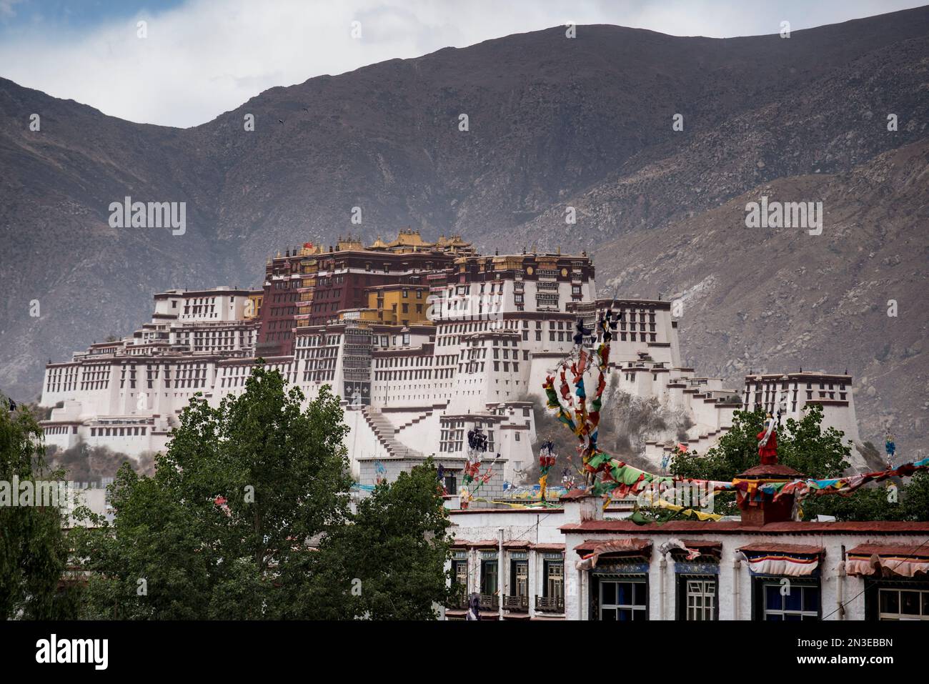 Potala Palace with prayer flags, once the Winter Palace of the Dalai ...