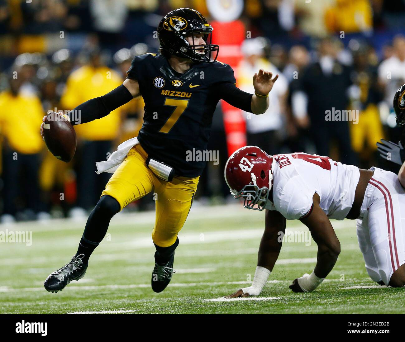 Missouri quarterback Maty Mauk (7) runs out of the pocket as Alabama ...