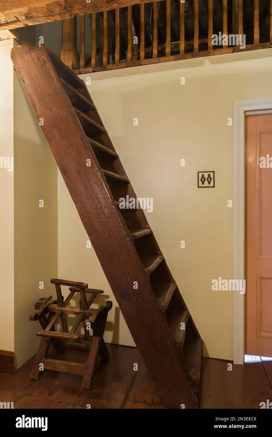 Wooden Miller's stairs on upper floor hallway leading to attic room ...