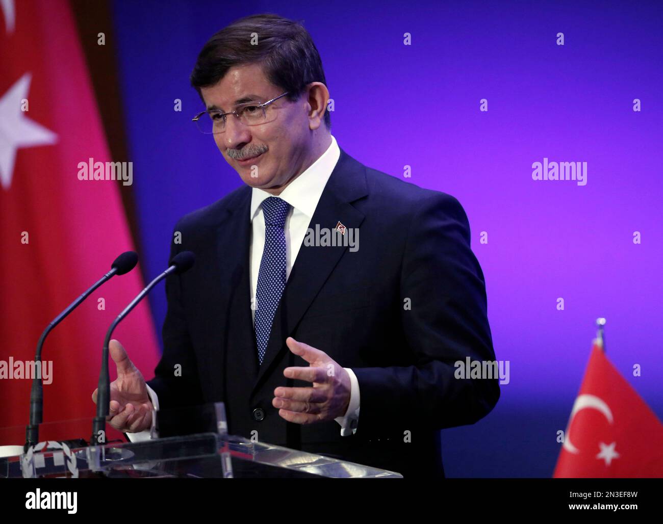 Turkish Prime Minister Ahmed Davutoglu, speaks to the media after ...