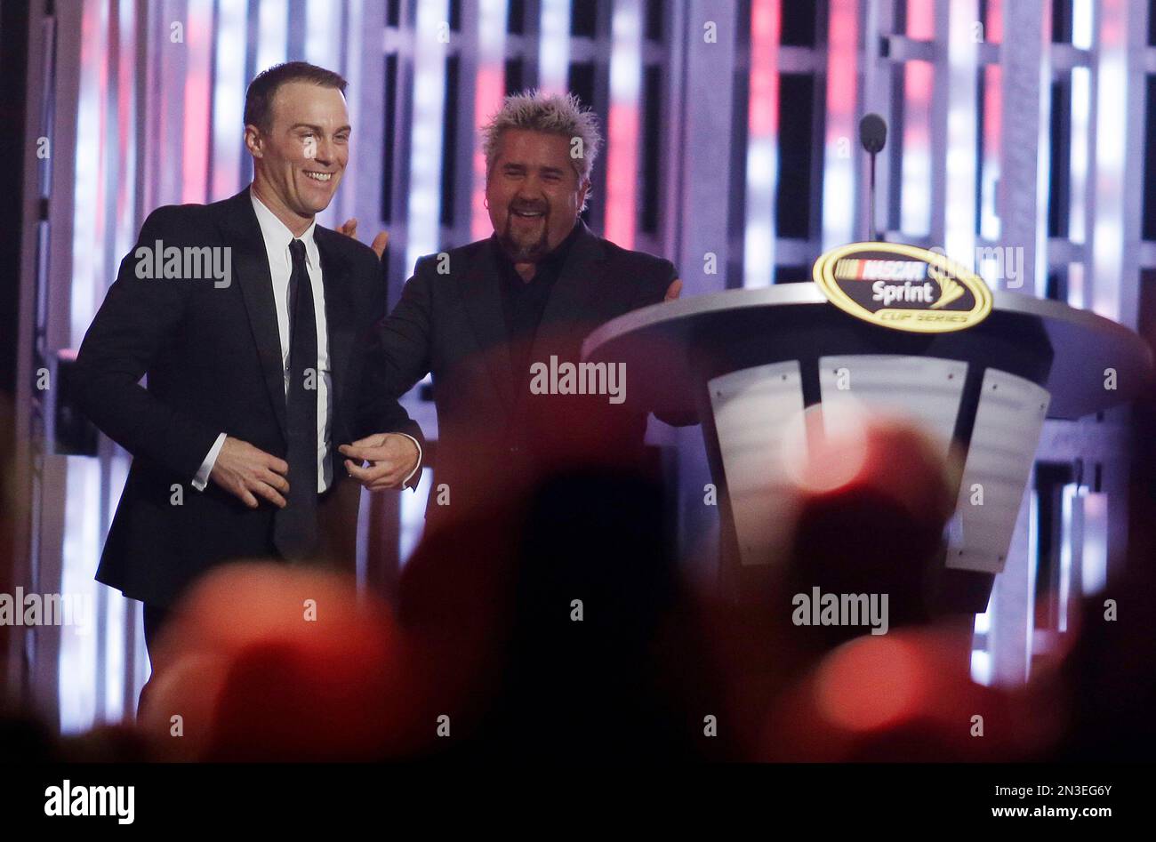 Guy Fieri, center, introduces Kevin Harvick to accept the championship ...