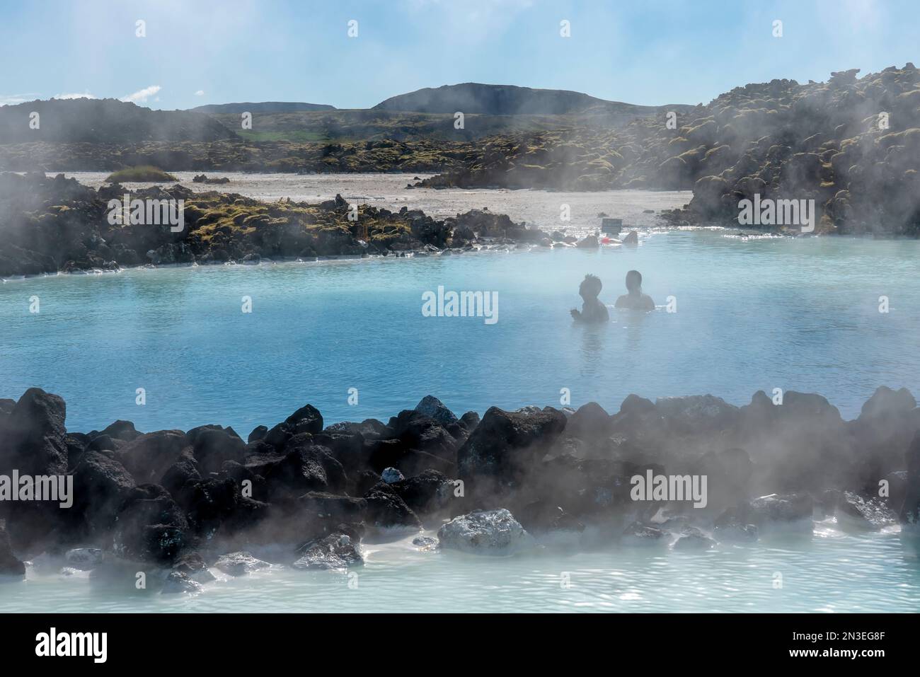People enjoying The Blue Lagoon, a man-made hot springs, lagoon near ...