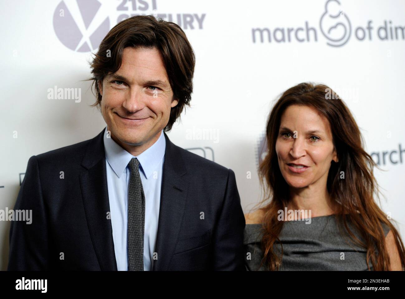 Host Jason Bateman and his wife Susan pose together at the 2014 March ...