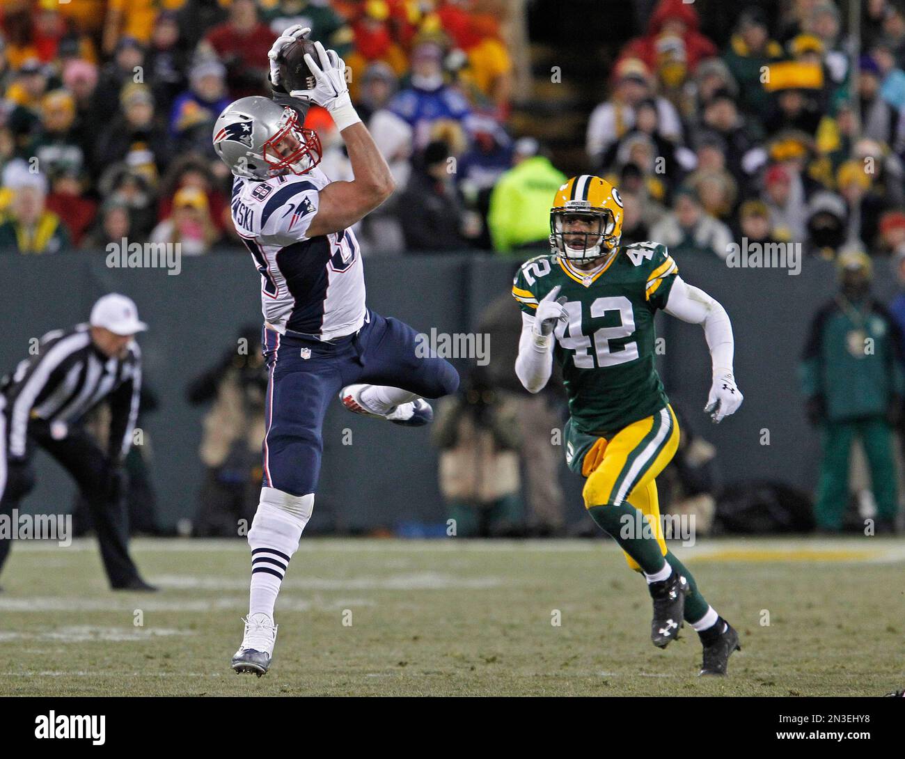 New England Patriots tight end Rob Gronkowski makes a catch while being ...
