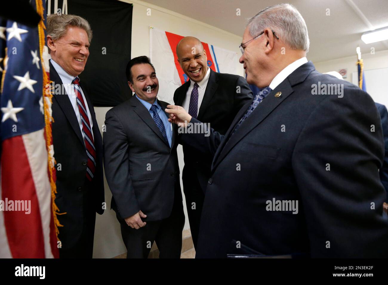 U.S. Sen. Robert Menendez, from right, talks to U.S. Sen. Cory Booker ...