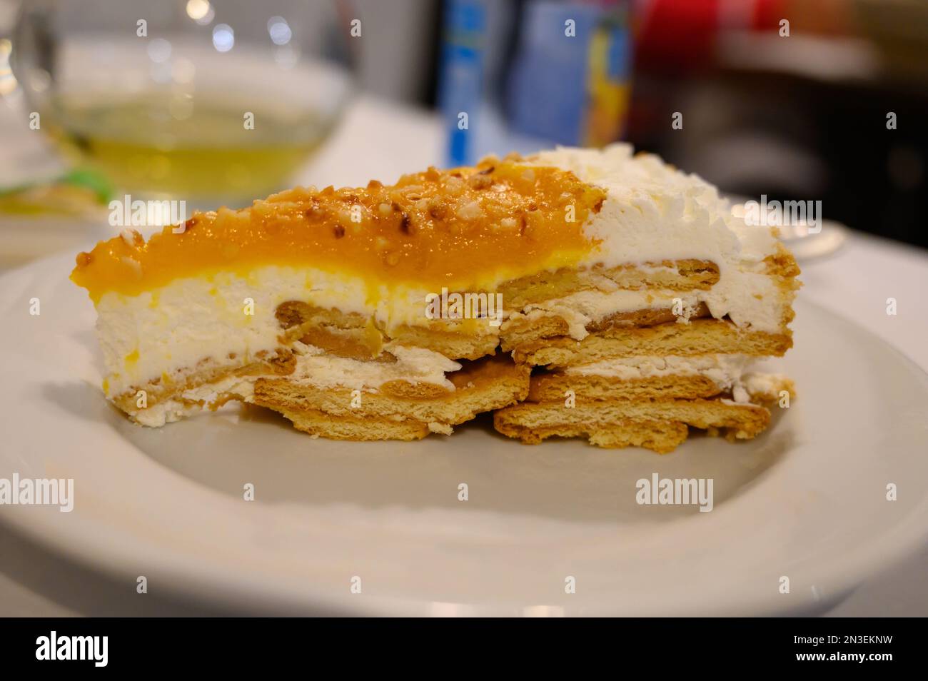 Traditional Portuguese cake with cream, fruits and cookies close up ...