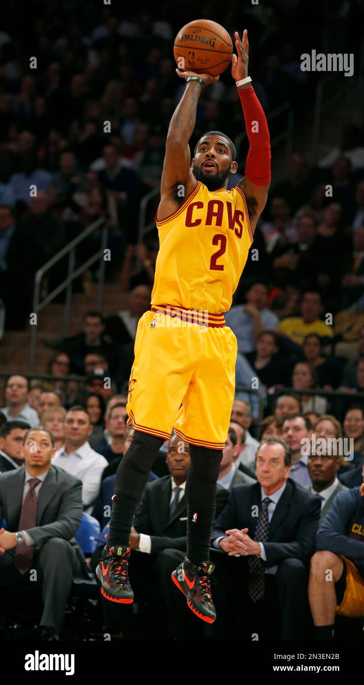 Cleveland Cavaliers guard Kyrie Irving (2) shoots a three point shot in ...