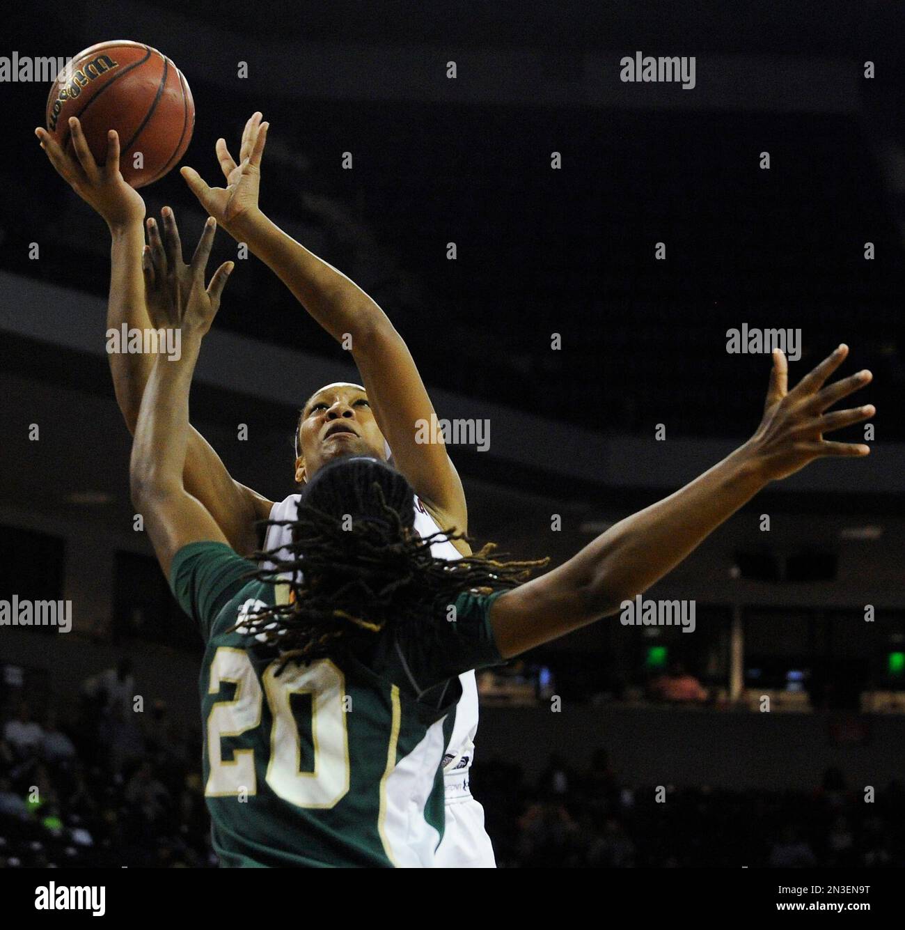 South Carolina guard A'ja Wilson, top, shoots over Charlotte guard Kira ...