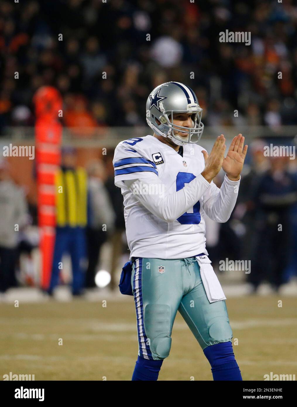 Dallas Cowboys quarterback Tony Romo (9) signals to the sidelines ...