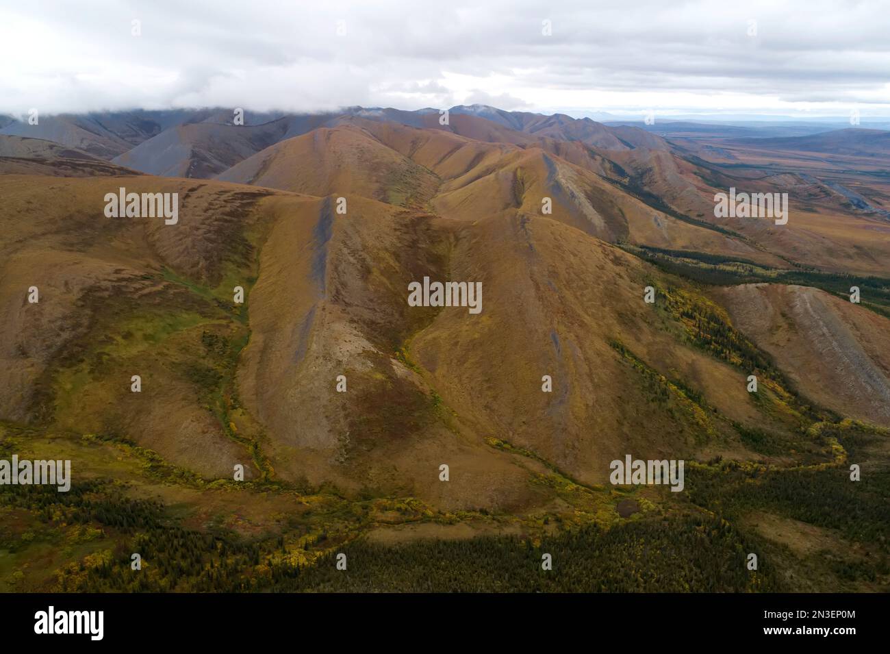 Aerial photograph of the Richardson Mountains with autumn colors above ...
