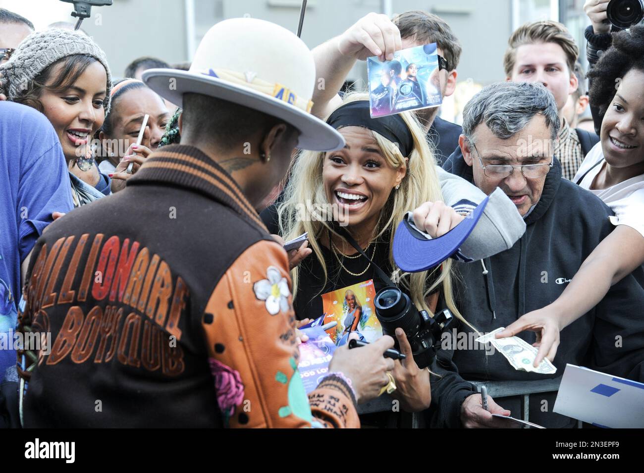 Pharrell Williams signs autographs for his fans after the ceremony ...