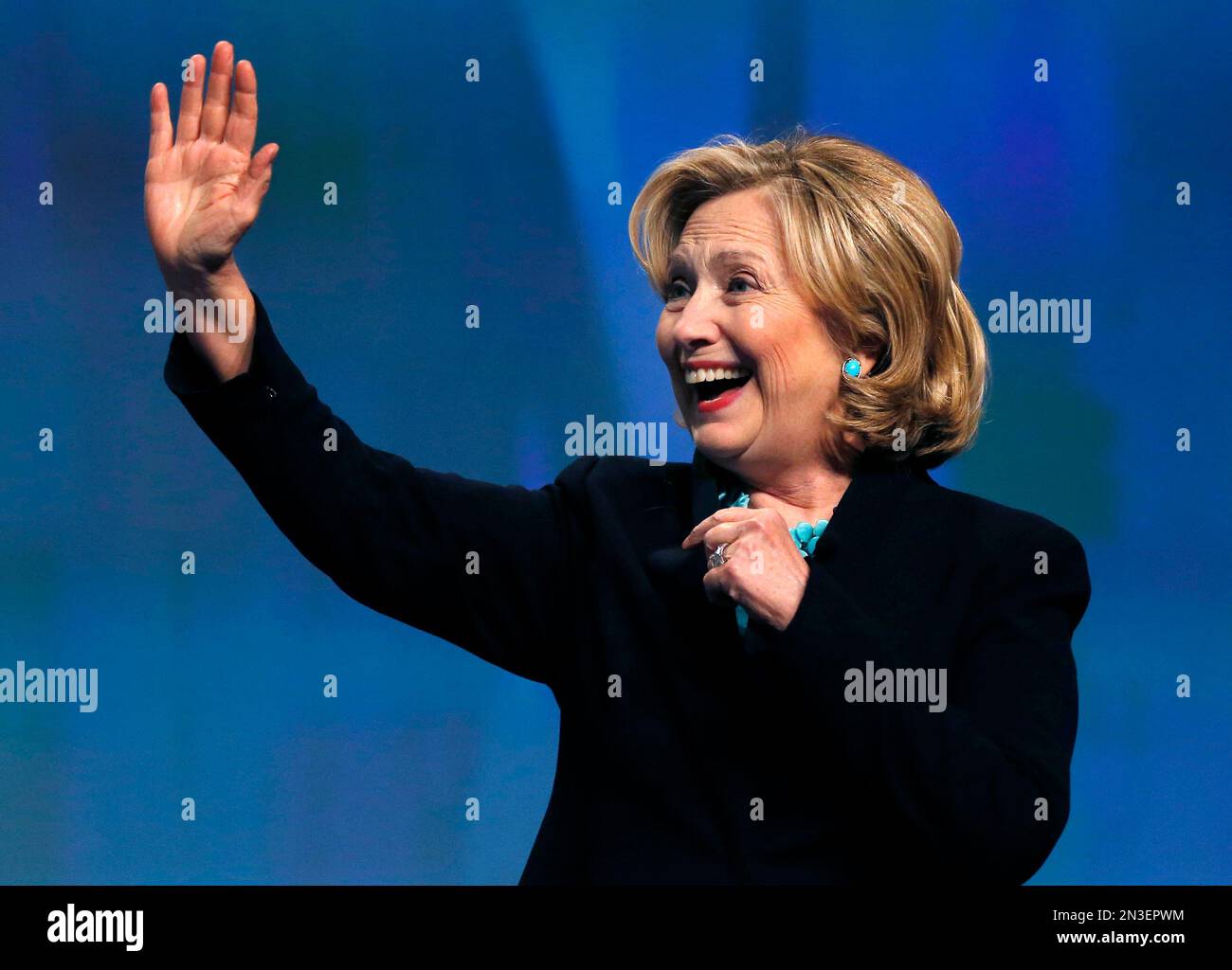 Former Secretary of State Hillary Rodham Clinton waves as she is ...
