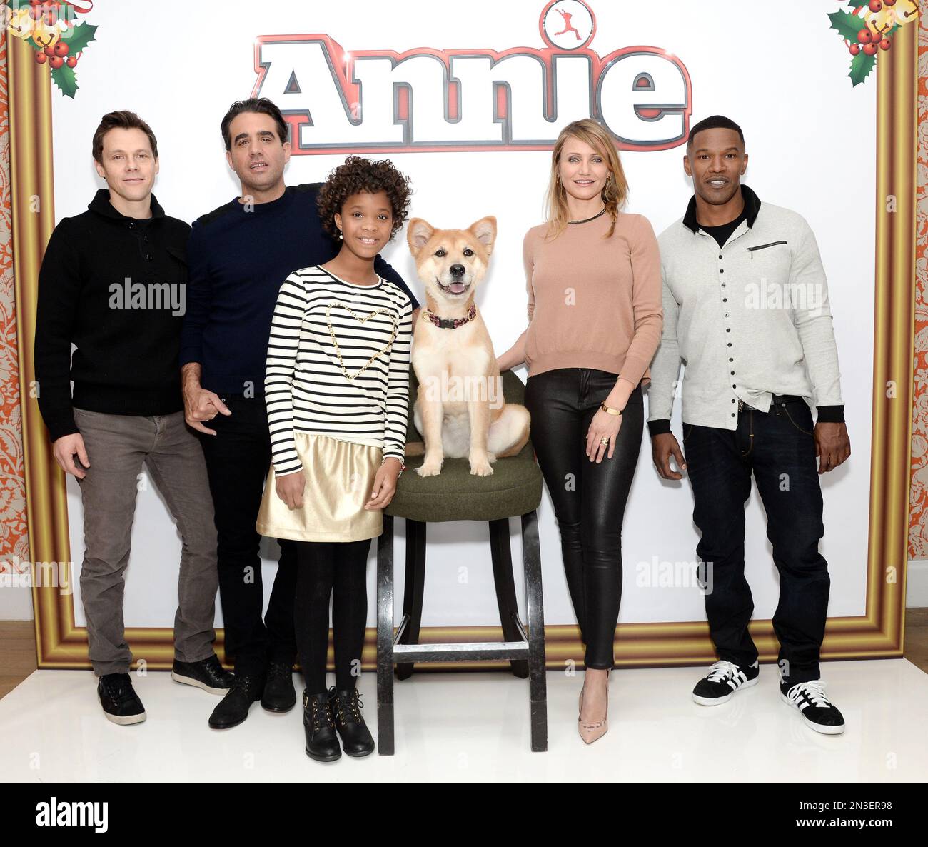 Director Will Gluck, far left, poses with the cast of "Annie", from ...