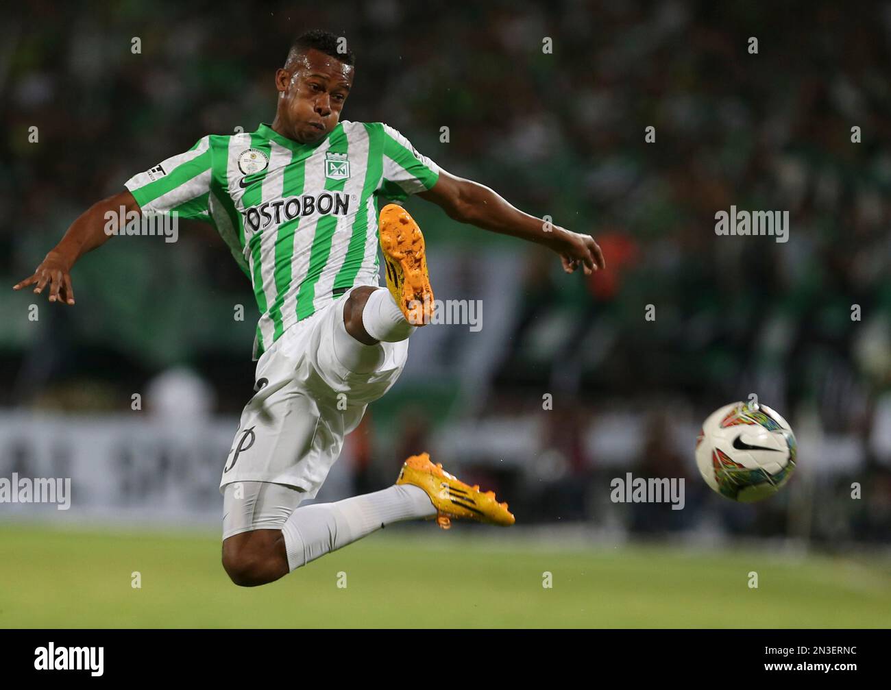 Jonathan Copete, of Colombia's Atletico Nacional, strikes the ball ...