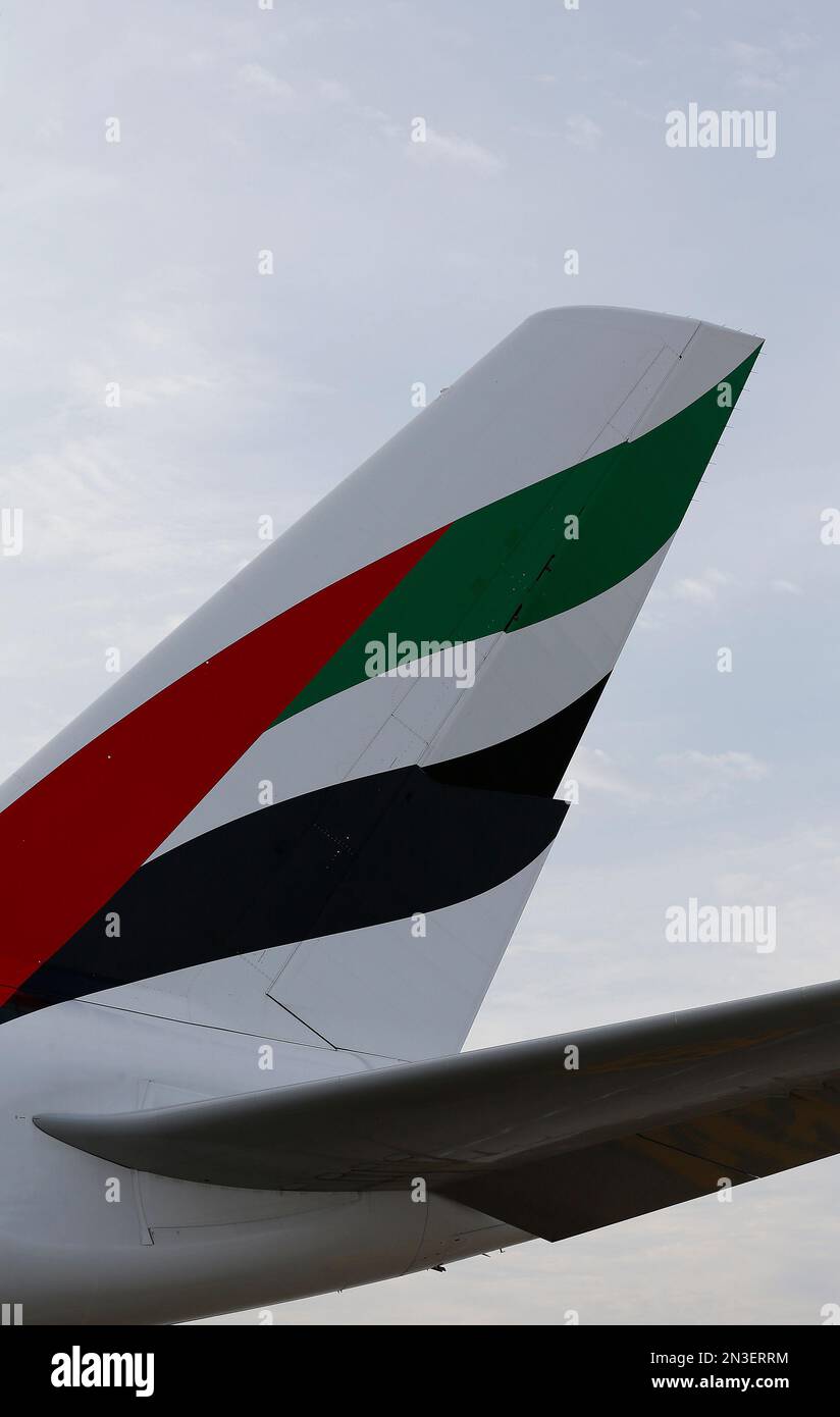 A detail view of the tail of an Emirates A380 plane is seen at the gate ...