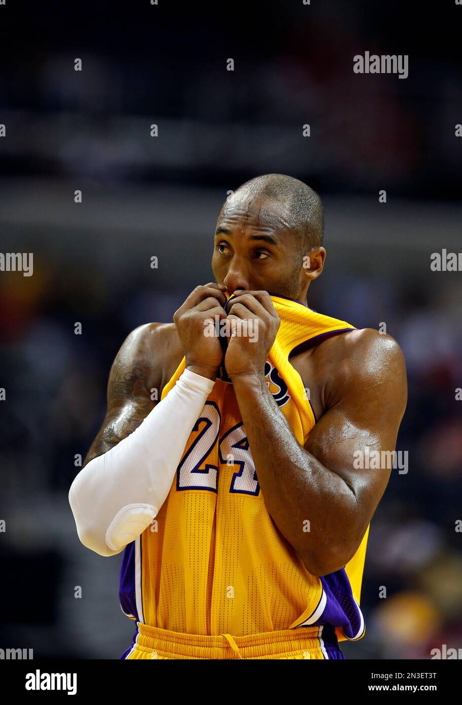 Los Angeles Lakers guard Kobe Bryant (24) wipes his face with his shirt ...