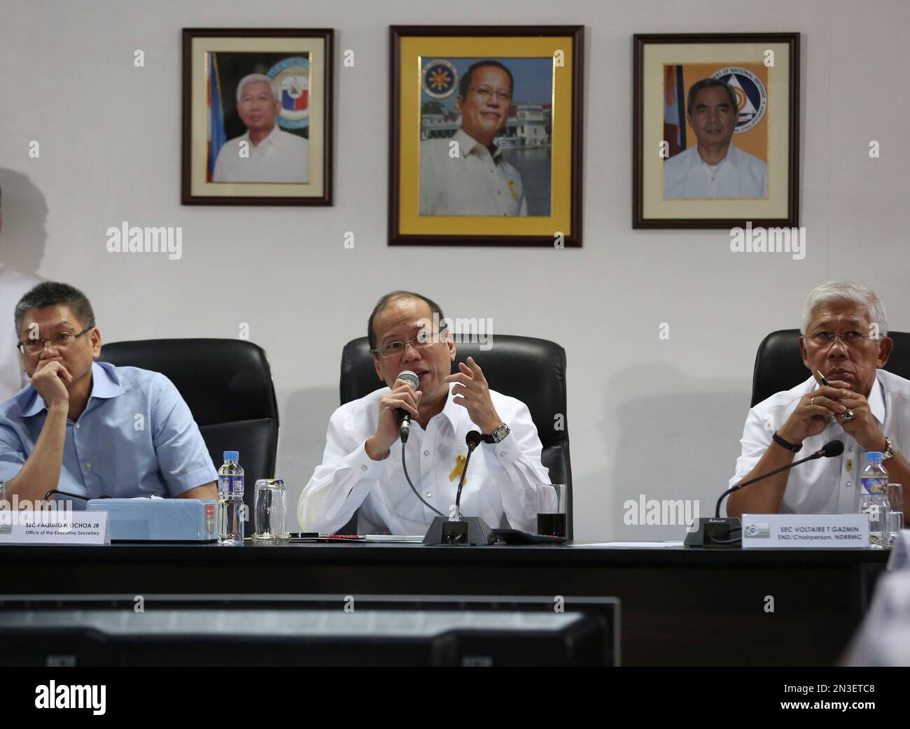 Philippine President Benigno Aquino III, center, talks as Executive ...