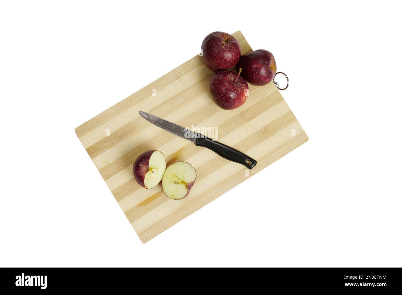 Sliced apple with knife on wooden board isolated on white background ...