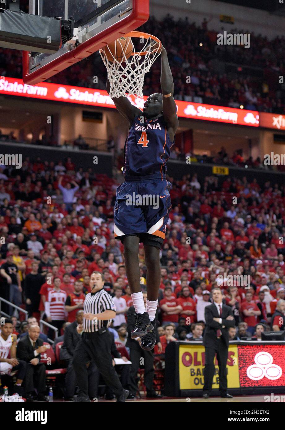 Virginia guard Marial Shayok (4) dunks against Maryland during the ...