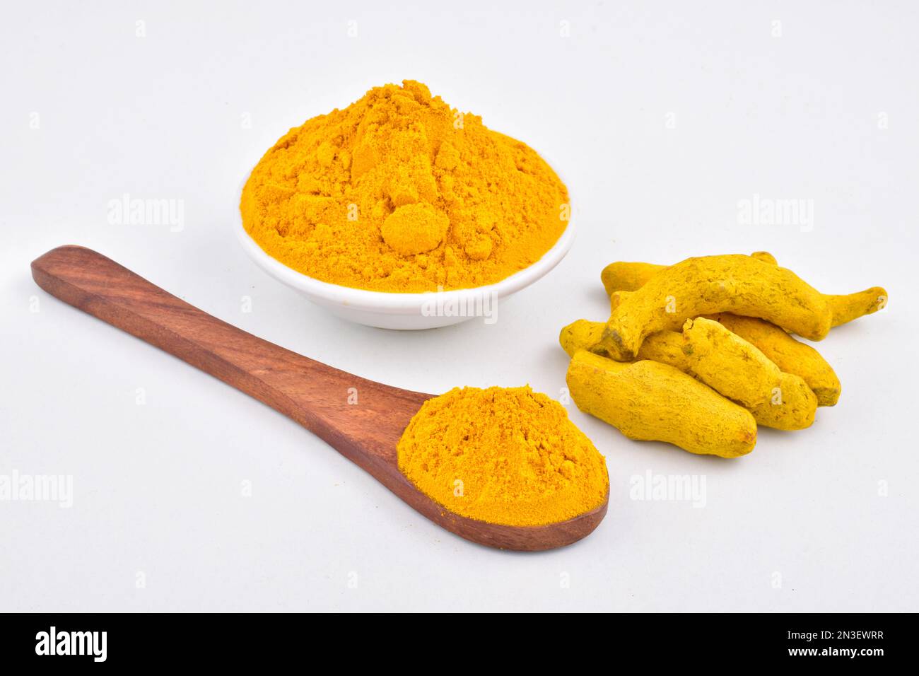 Dry turmeric with turmeric powder in spoon on white background Stock ...