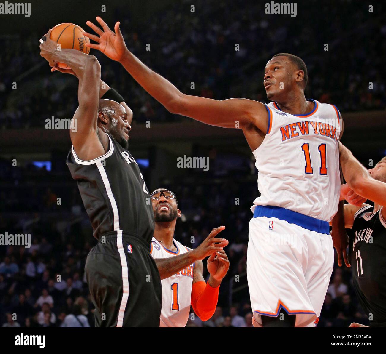 New York Knicks center Samuel Dalembert (11) defends Brooklyn Nets ...