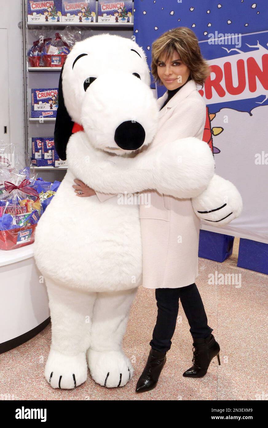 Lisa Rinna, right, and Snoopy celebrate the launch of the new NESTLE ...