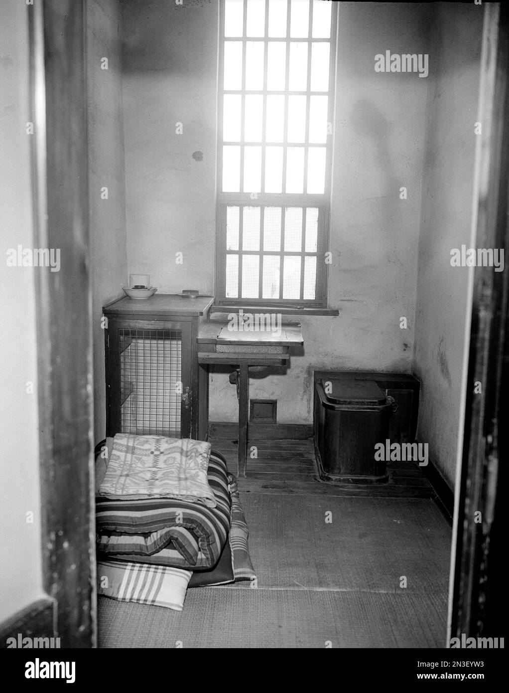 Photo shows a one-man cell at Sugamo Prison in Tokyo, Japan, similar to ...