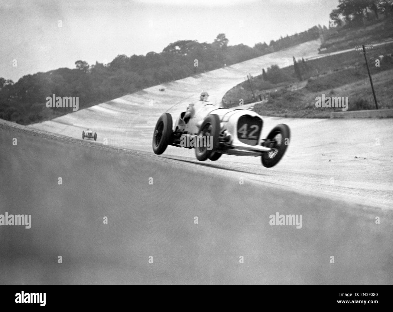 John Cobb in his Napier-Railton car, banking during the 500 mile motor ...