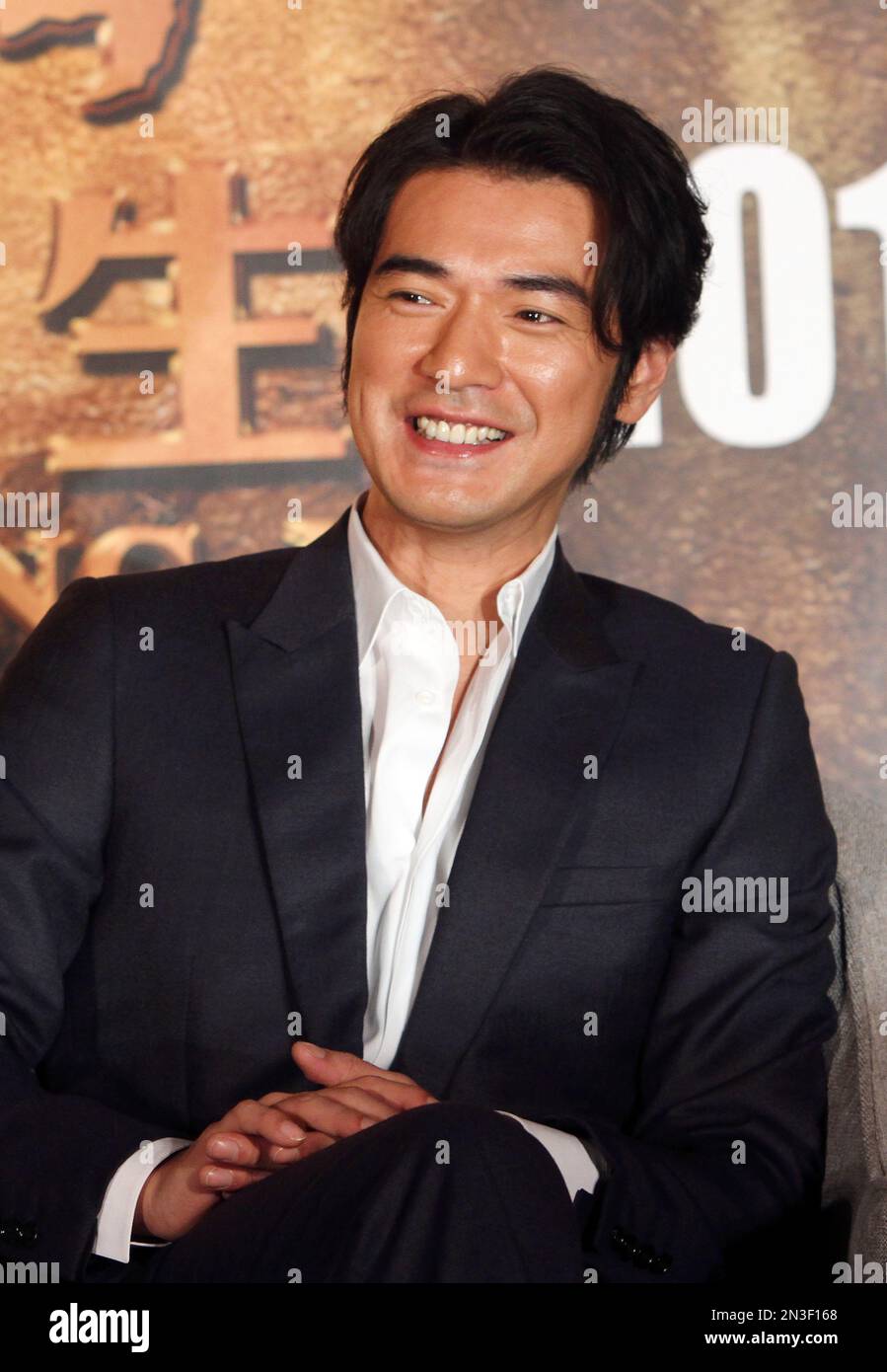 Taiwan-born Japanese actor Takeshi Kaneshiro smiles during an event to ...