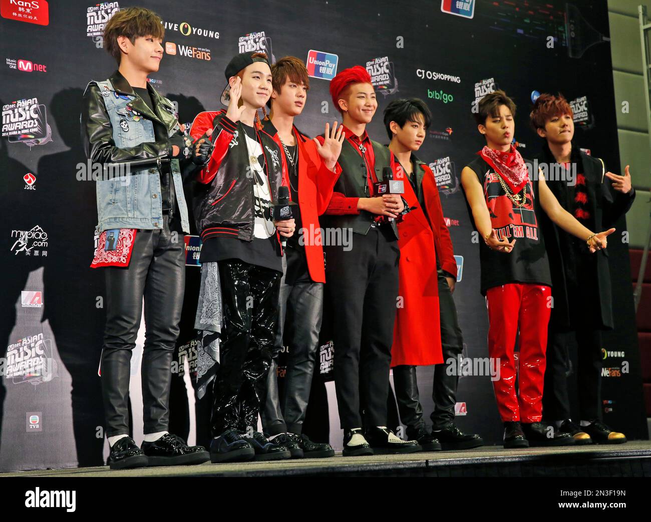 South Korean music band BTS pose for the photographers during the news ...