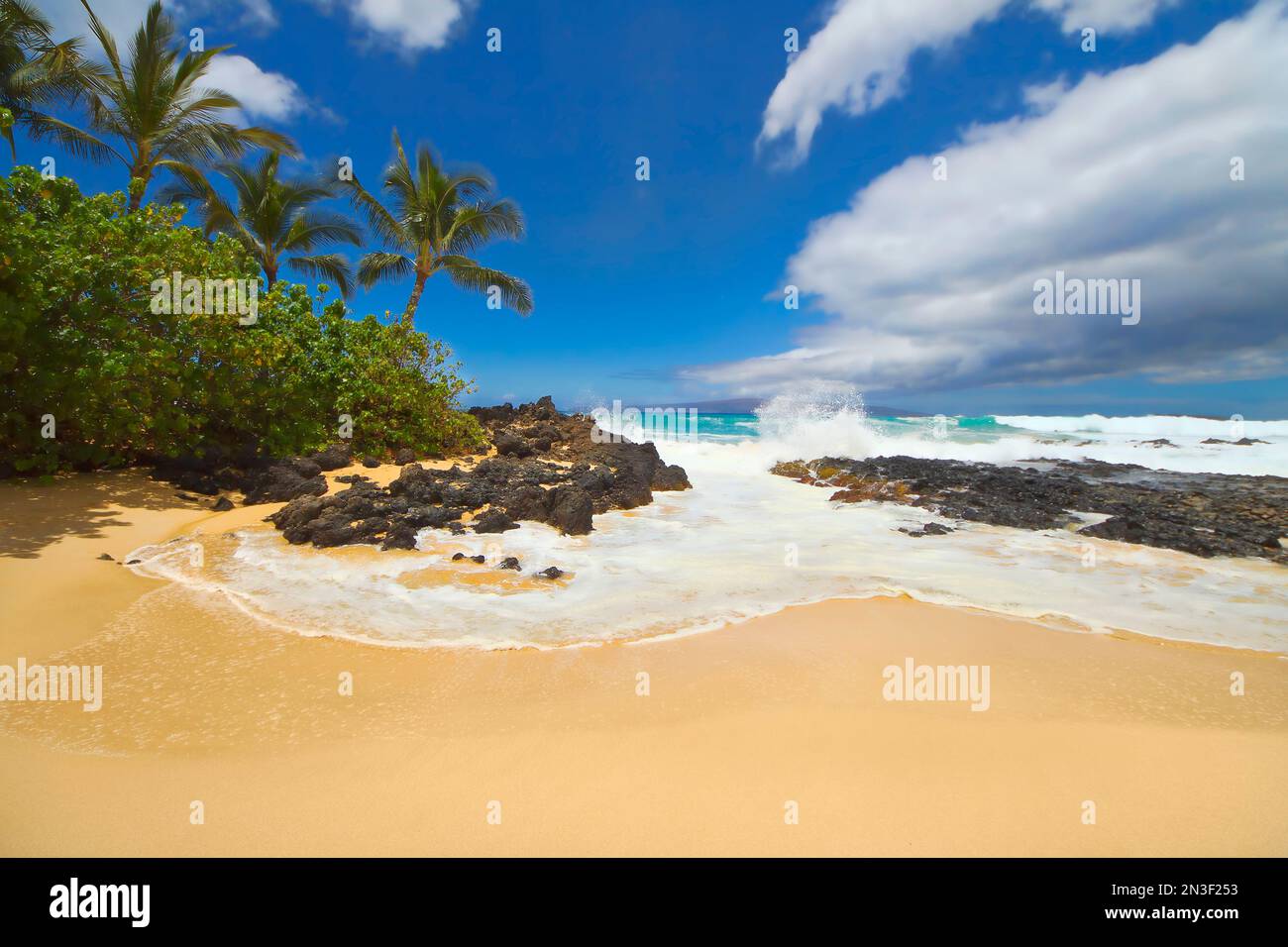 Surf, sand and palm trees at Makena Cove, also known as Secret Beach ...