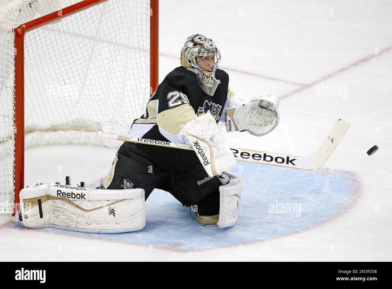 Pittsburgh Penguins goalie Marc-Andre Fleury (29) makes a stick save ...