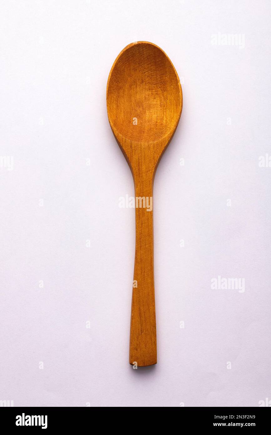 Wooden spoon, kitchen utensil on white background Stock Photo - Alamy