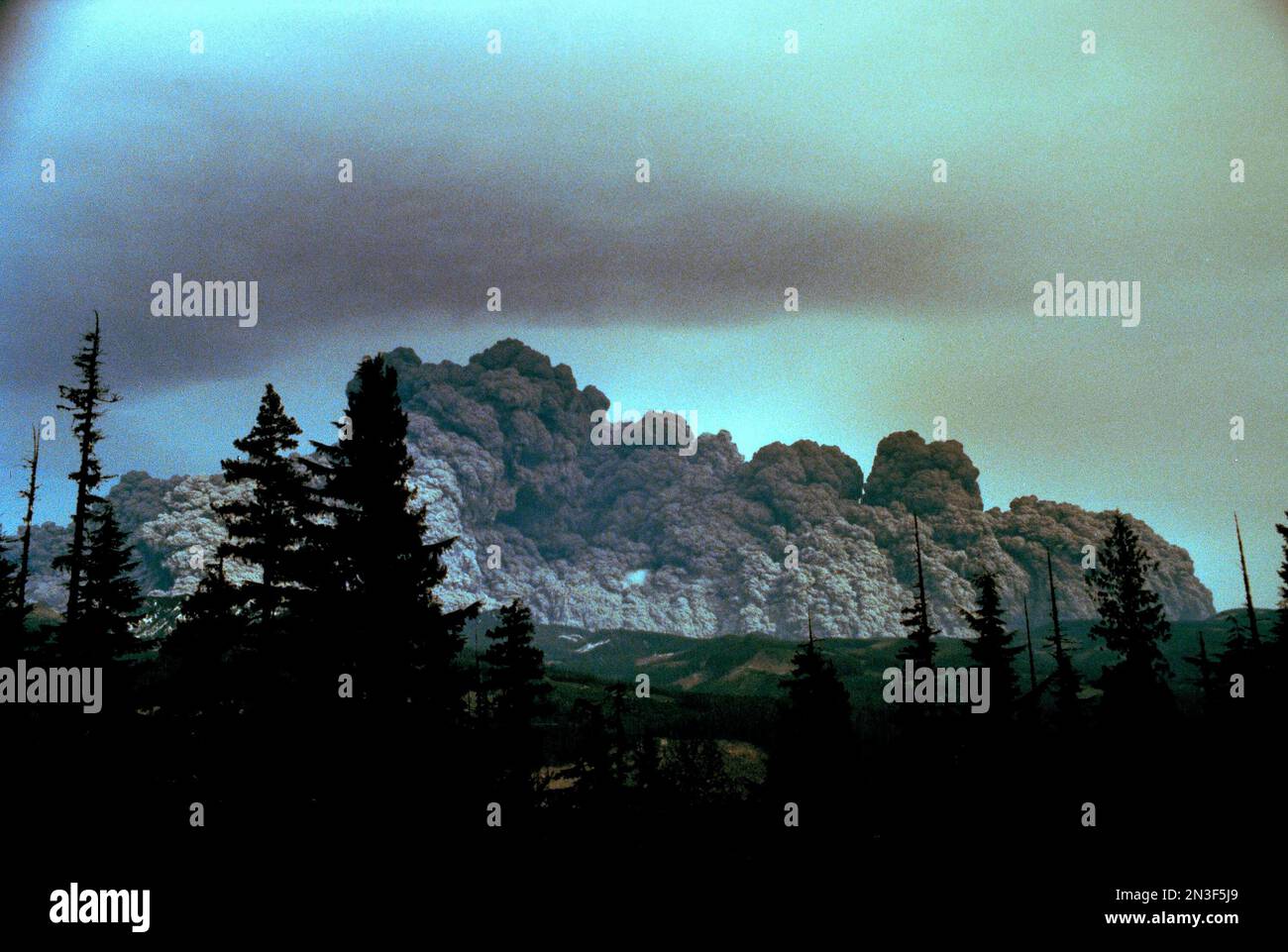 Mount St. Helens in Washington state is shown in various stages of ...