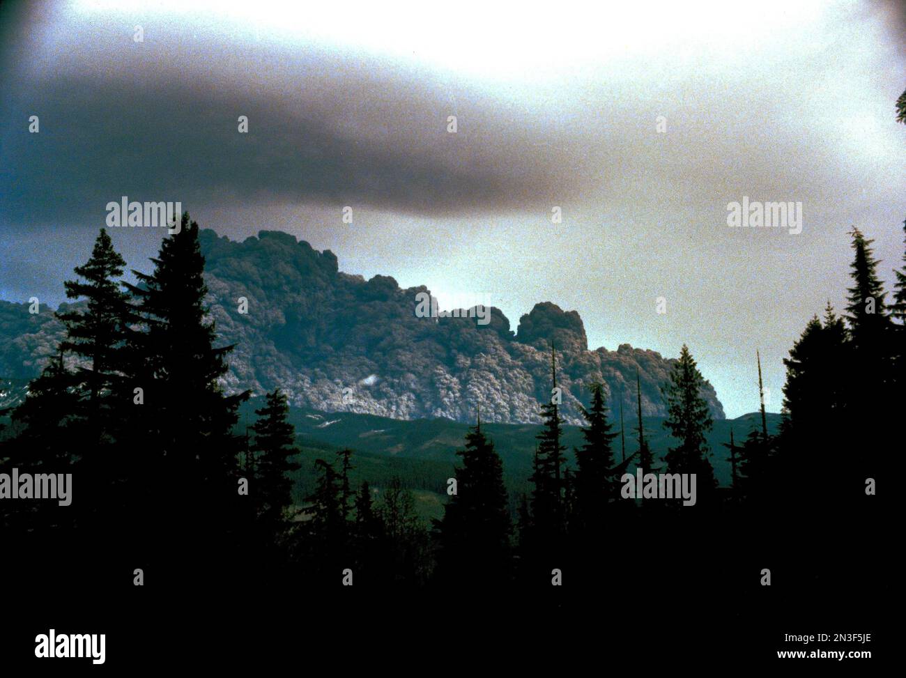 Mount St. Helens in Washington state is shown in various stages of ...