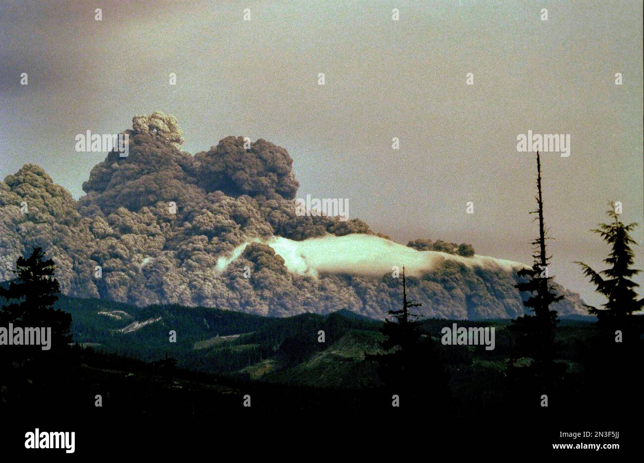 Mount St. Helens in Washington state is shown in various stages of ...