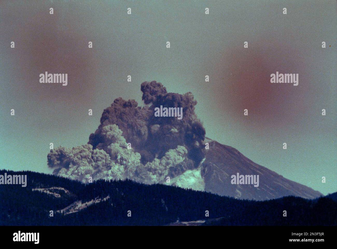 Mount St. Helens in Washington state is shown in various stages of ...