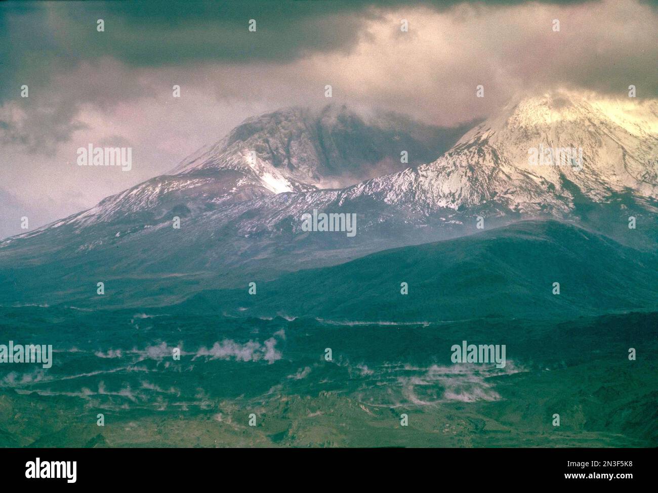 Mount St. Helens in Washington state is shown in various stages of ...