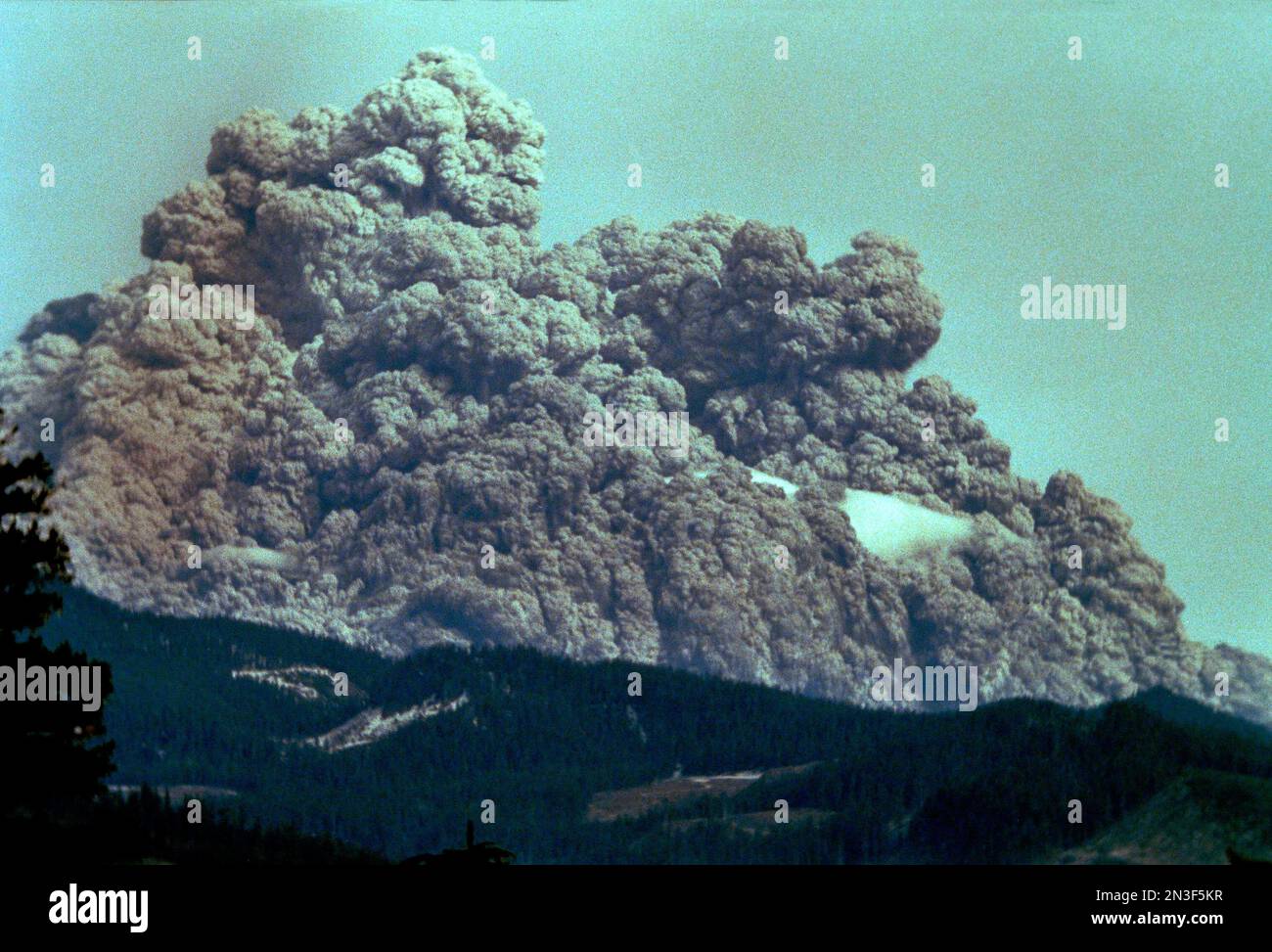 Mount St. Helens in Washington state is shown in various stages of ...