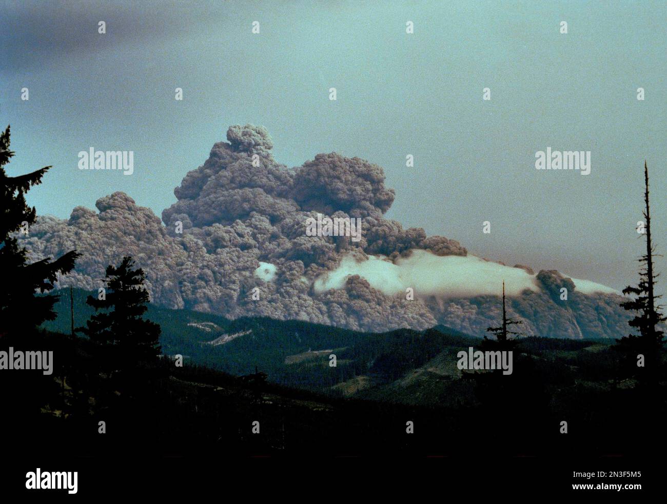 Mount St. Helens in Washington state is shown in various stages of ...