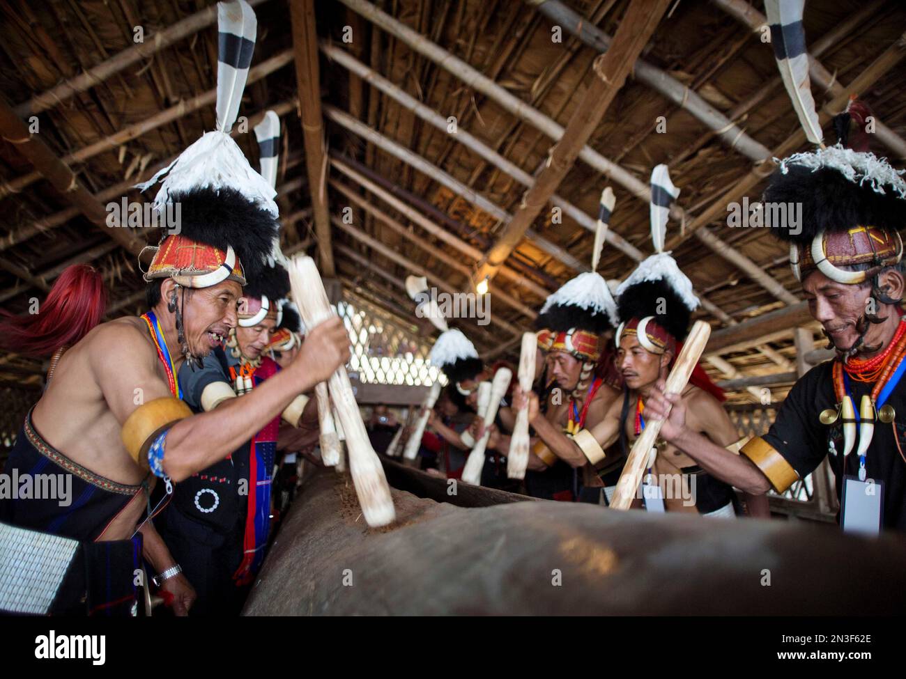 India’s Naga tribe play a traditional instrument made from a gigantic ...