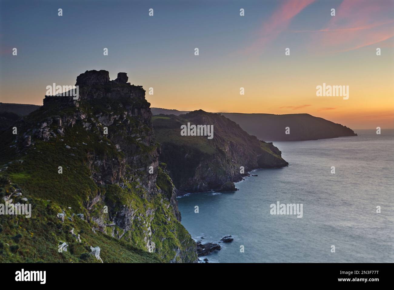 Sunset over cliffs at the Valley of Rocks, Lynton, Exmoor National Park ...