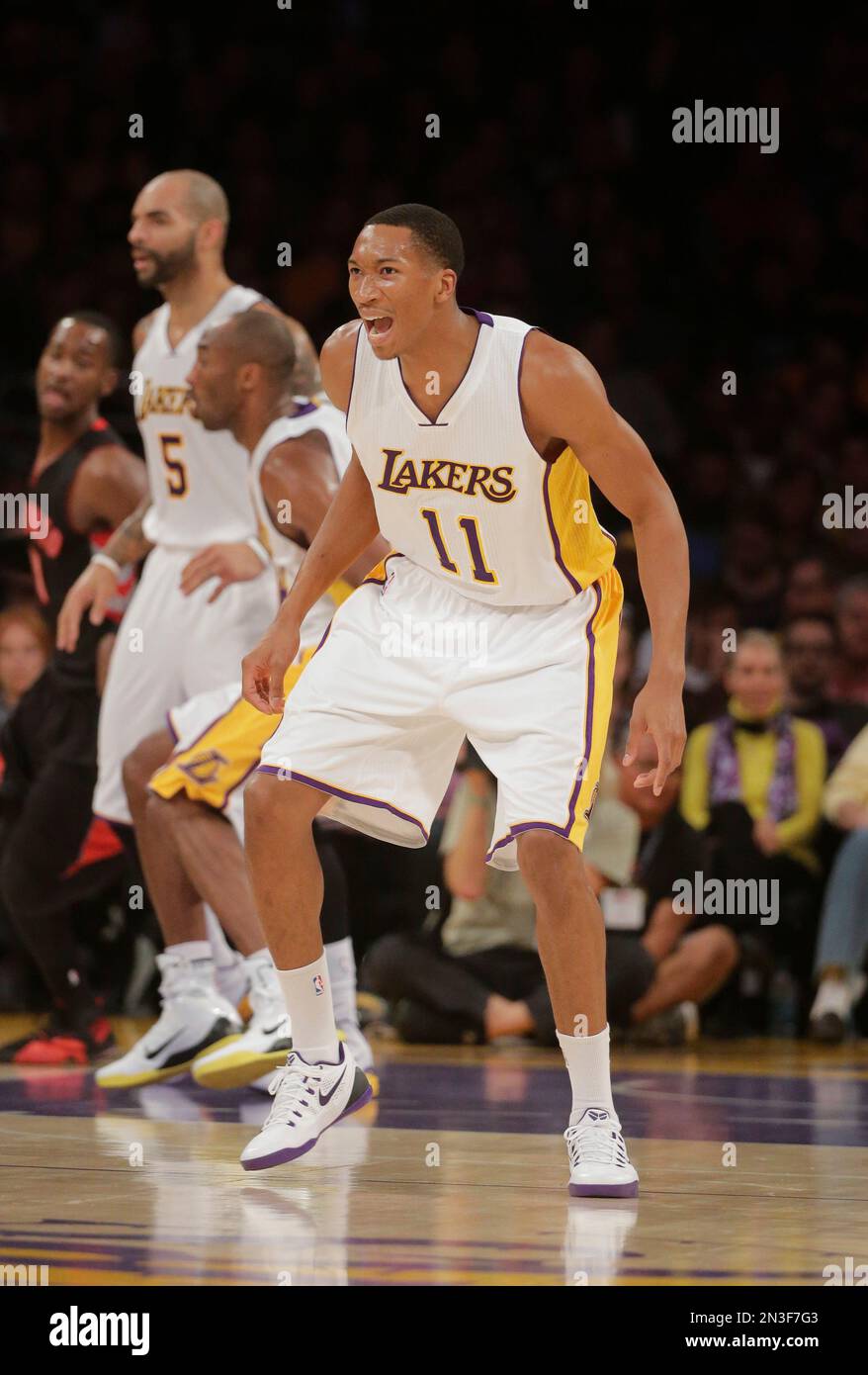 Los Angeles Lakers' Wesley Johnson yells to a teammate during the first ...