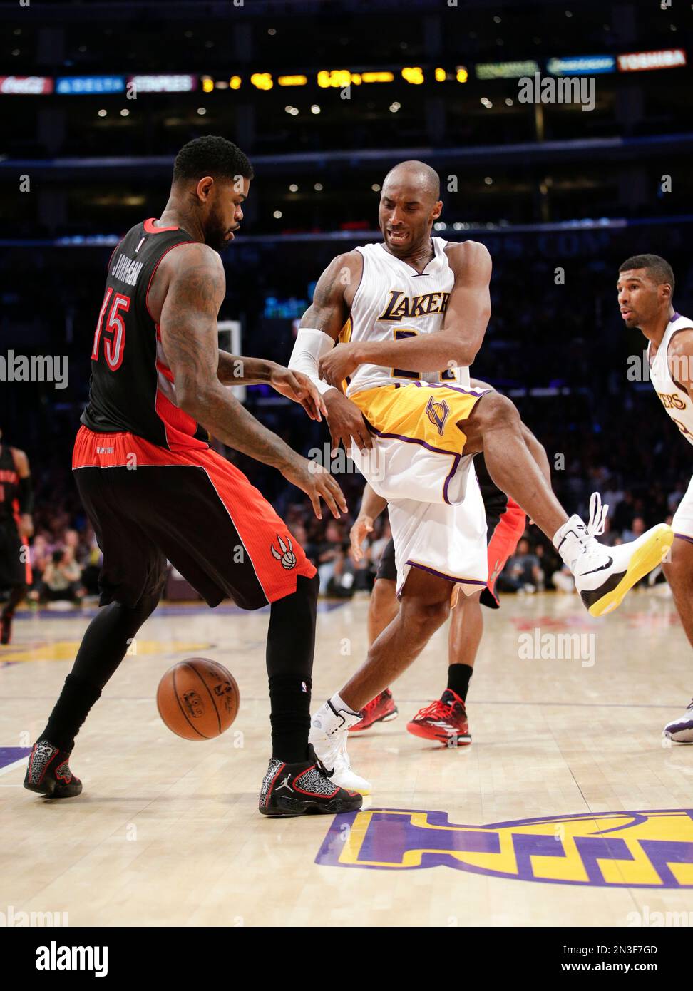 Los Angeles Lakers' Kobe Bryant, right, is defended by Toronto Raptors ...