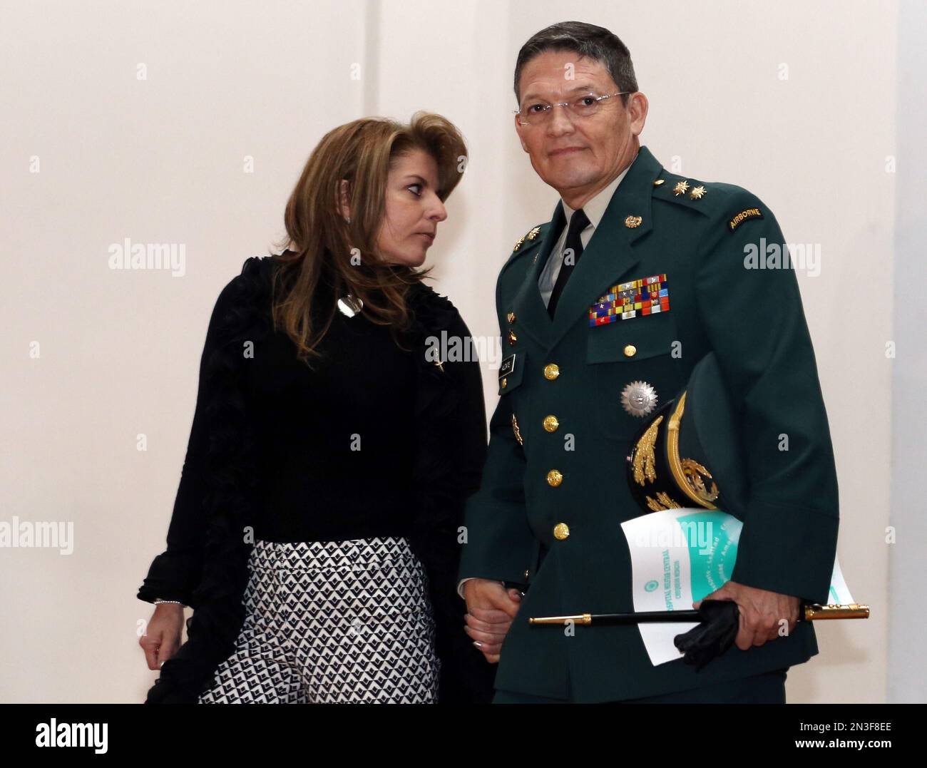 Army Gen. Ruben Alzate arrives with his wife, Claudia Farfan to read a statement for the press ...