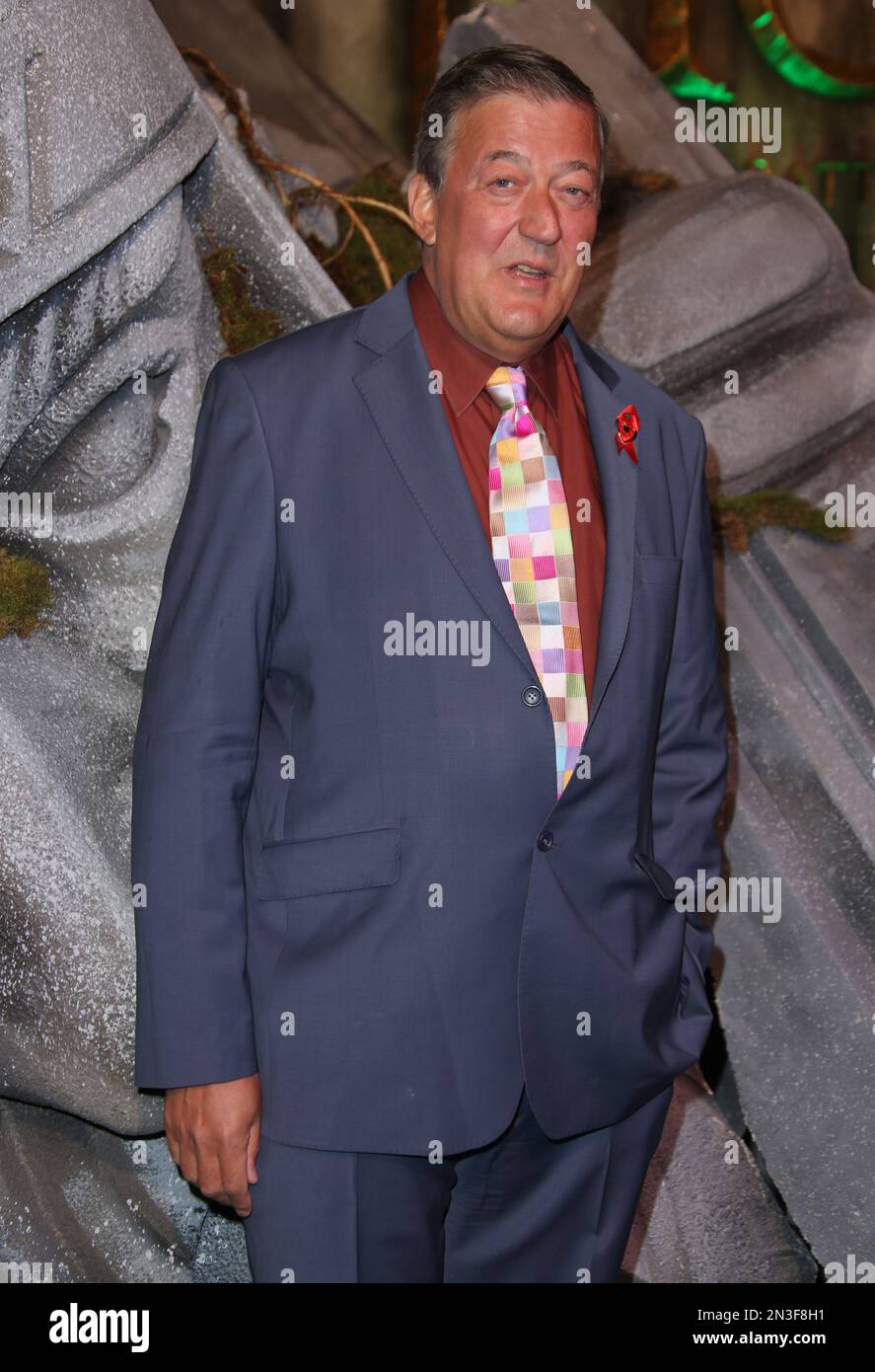 Stephen Fry poses for photographers upon arrival at the World premiere ...