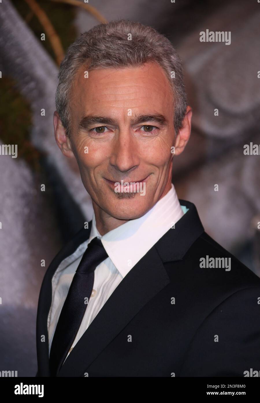 Actor Adam Brown poses for photographers upon arrival at the World ...